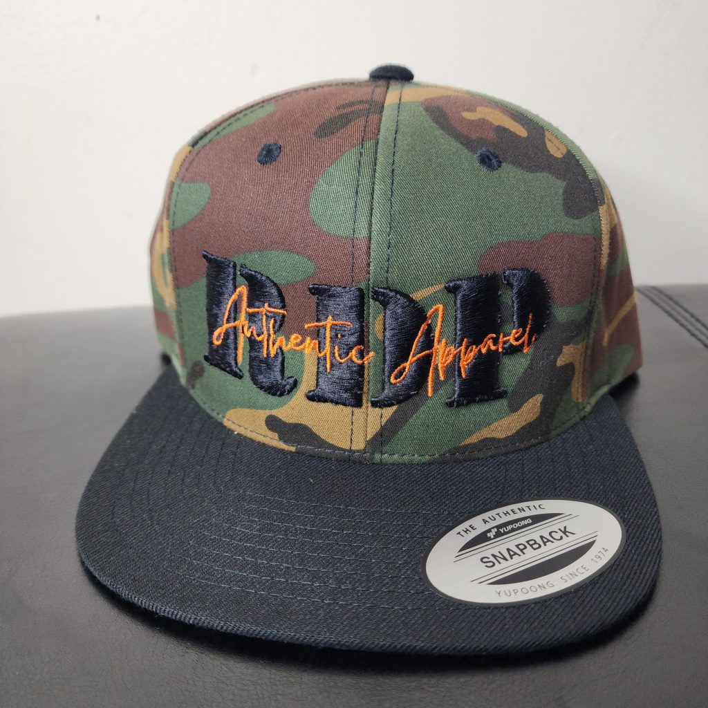 RDP CAMO SNAPBACK, W/BLACK, ORANGE, WITH BLACK BRIM - RE$PECT DA PLUG AUTHENTIC APPAREL